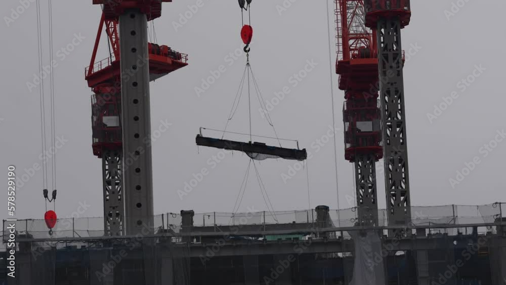 Skyscraper building under construction in Tokyo. 4K video with cranes ...