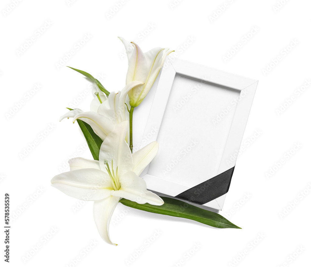 Blank funeral frame and beautiful lily flowers on white background ...
