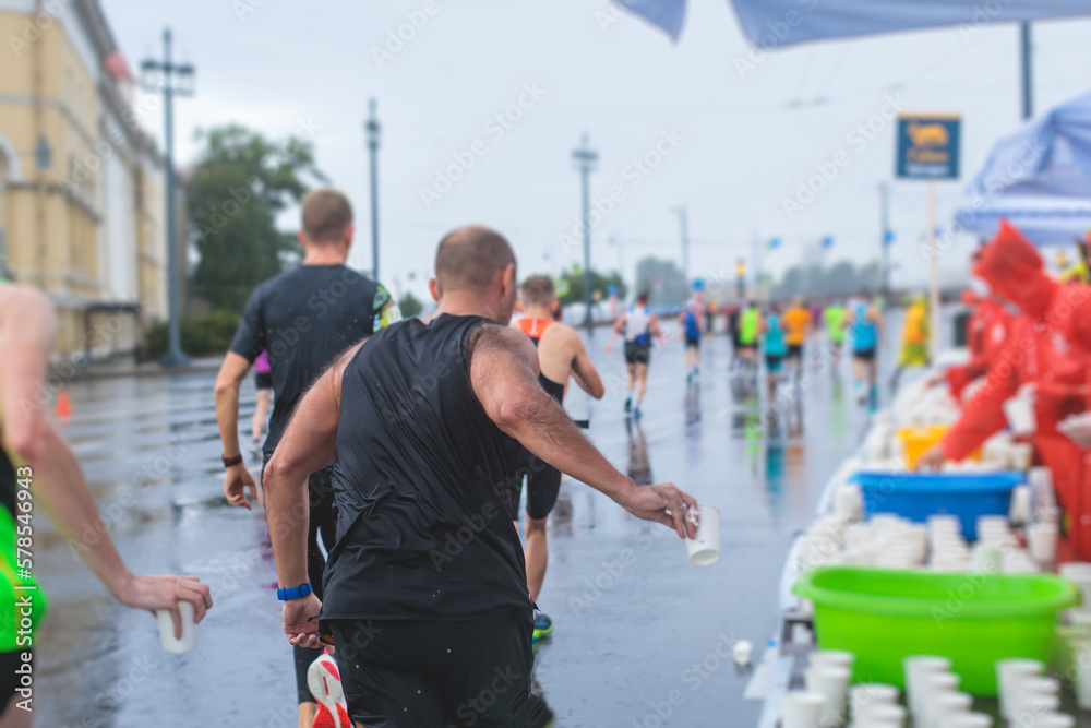 Foto de Marathon runners crowd, participants start running the half ...