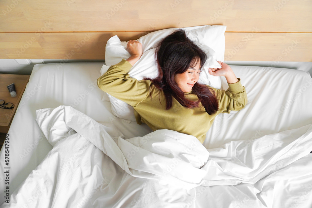 Portrait of beauty happy Asian woman awaking, wake up on the bed (sleep ...
