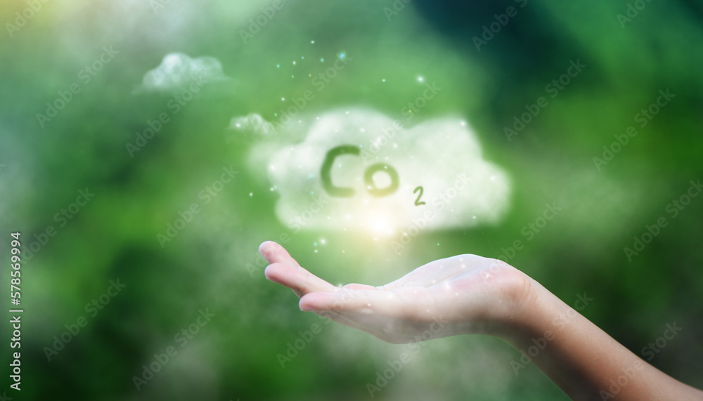 Reduce CO2 emission concept. CO2 emission reduction concept in hand ...