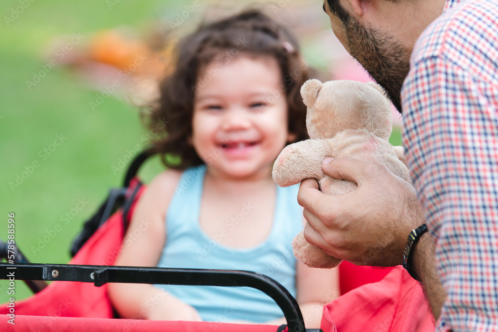 Selective focus on small bear doll in father hands, little Caucasian ...