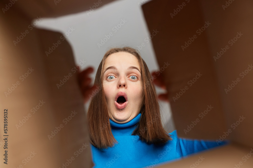 Shocked Amazed Caucasian Woman Customer With Brown Hair Wearing Blue