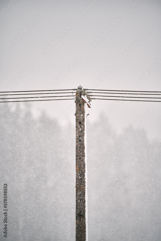 Heavy snow on electrical wires. Frozen electric wires in the city ...