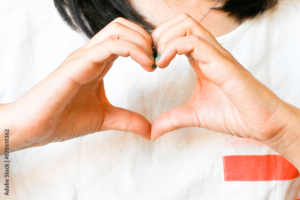 Foto de Woman making hand in heart shape, self love, self care ...