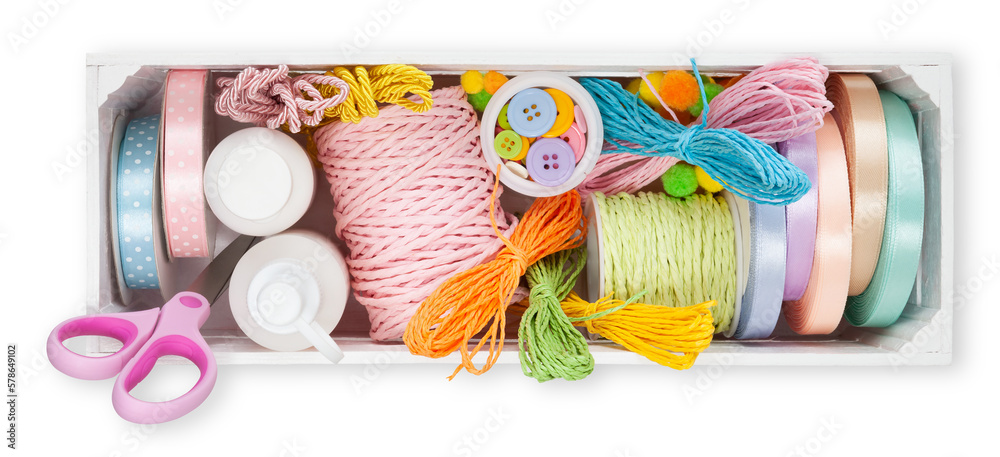 box with Rolls of satin bright ribbons and strings for decorations ...