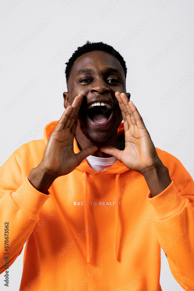 Angry black guy yelling screaming shouting at camera holding hands near ...