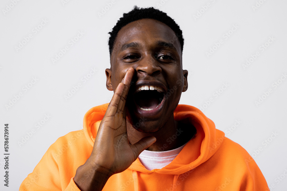 Furious angry handsome black african american guy holding hands near ...