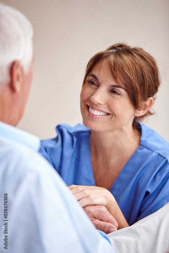 Checking up on his daily progress. a female nurse checking on her ...