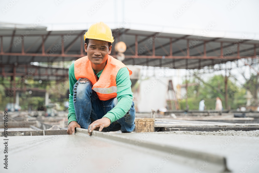 Construction technician working by leveling concrete floor to smooth ...