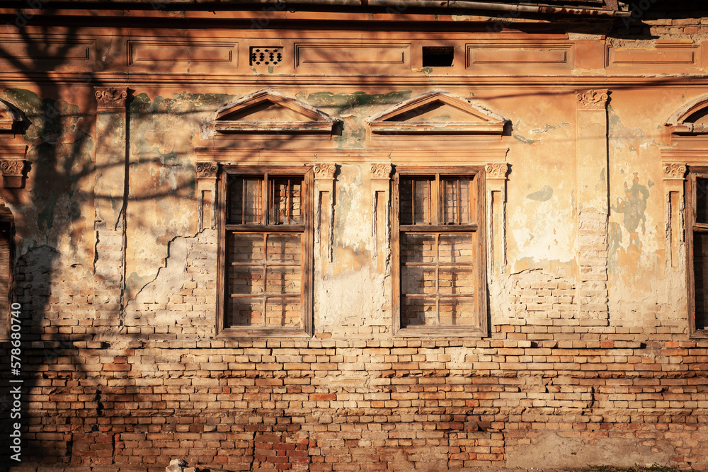 Condemned bricked up boarded windows on an old an abandoned farm, a ...