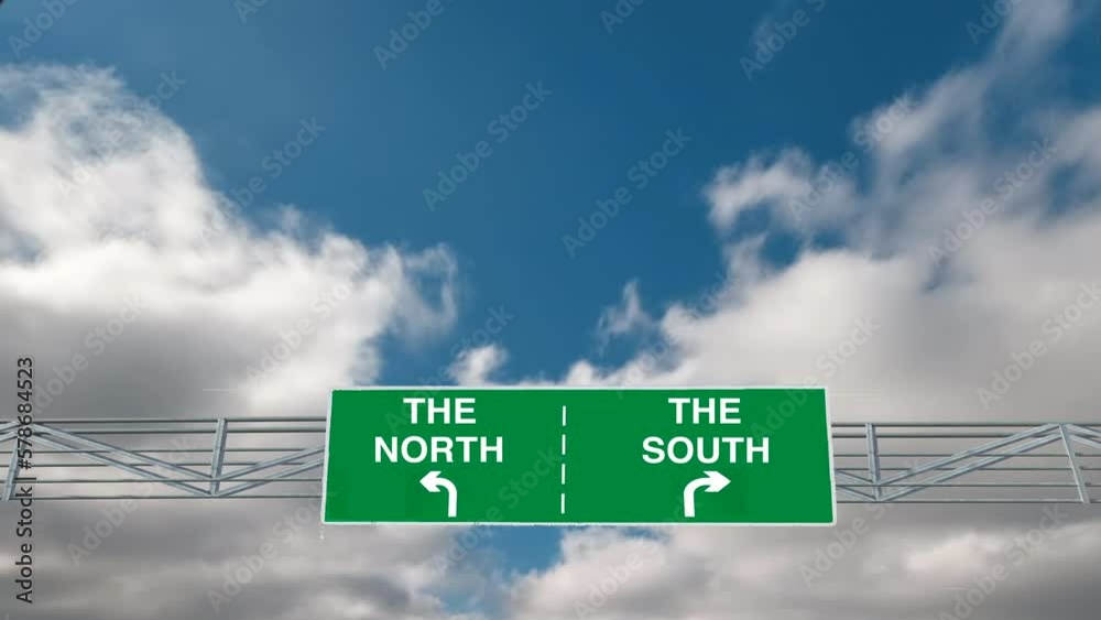 Zoom to an overhead road signs pointing the way in opposite directions ...