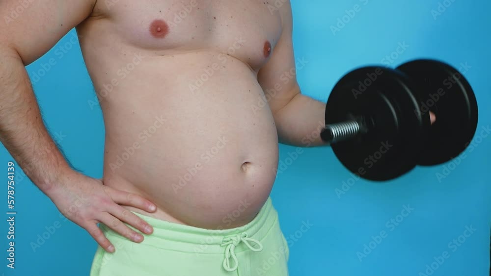 A fat man without muscles with saggy skin, a fat man poses in front of ...