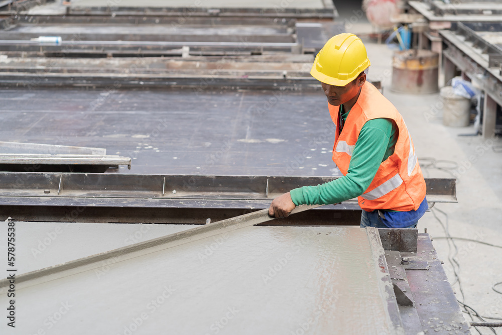 Construction technician working by leveling concrete floor to smooth ...