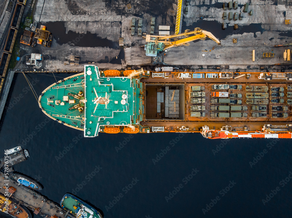 Aerial top view cargo ship with military equipment for transportation ...