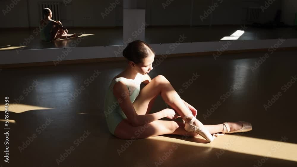 Tender teen girl, classical ballet dancer getting ready to train in ...