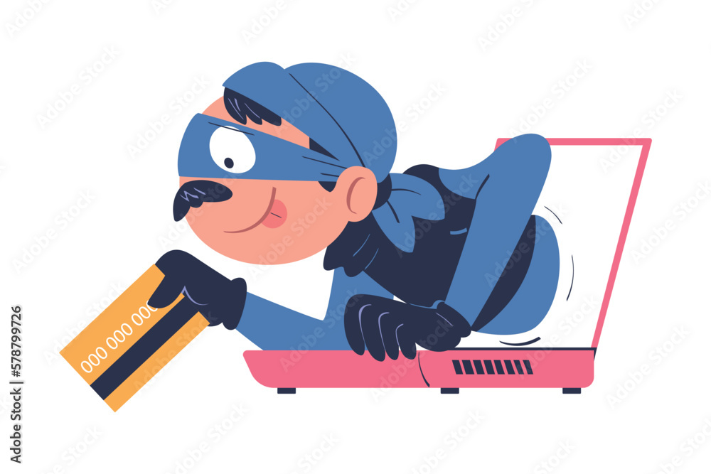 Masked cyber thief stealing credit card from laptop computer, hacker ...