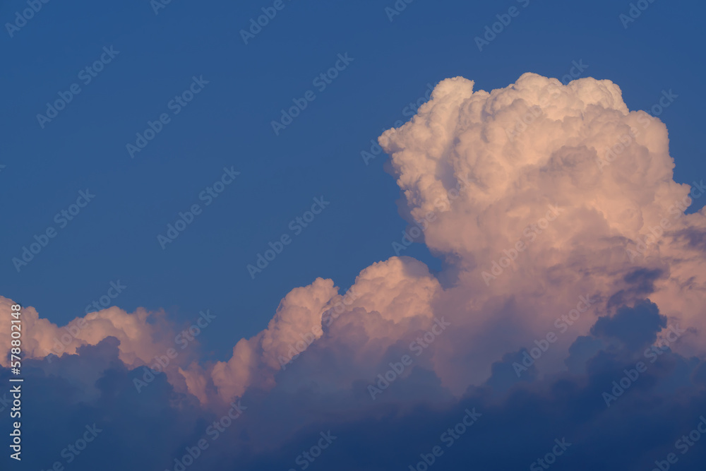 Beautiful cloudscape view of huge cumulus fluffy clouds growing over a ...