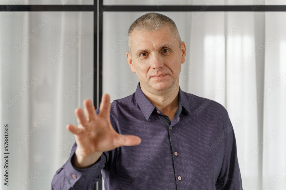 Portrait of a psychosomatic psychologist making a hand gesture to ...