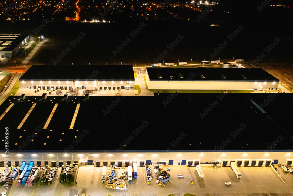 Aerial view of a warehouse of goods at night. Logistics center in the ...