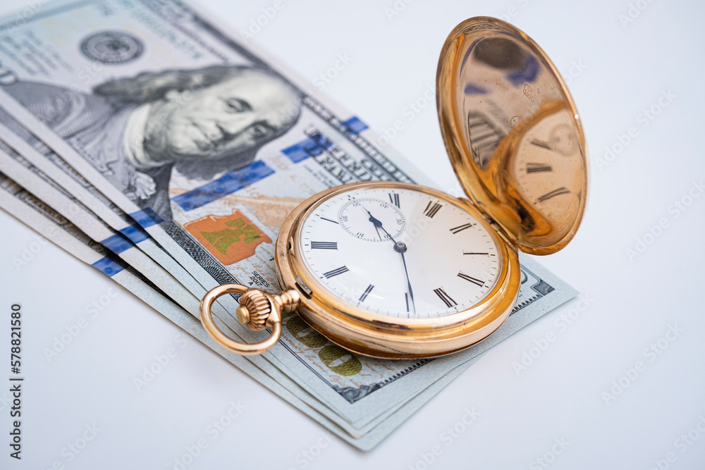 Macro shot of pocket watch face with 100 dollar bill Ben Franklin money ...
