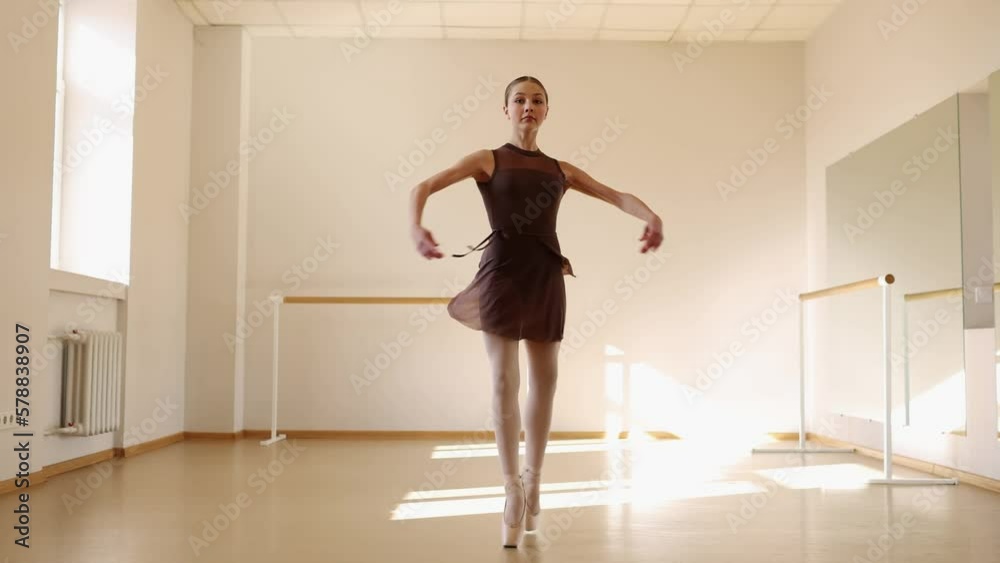 Spinning. Beautiful teen girl, ballet dancer training, dancing on ...