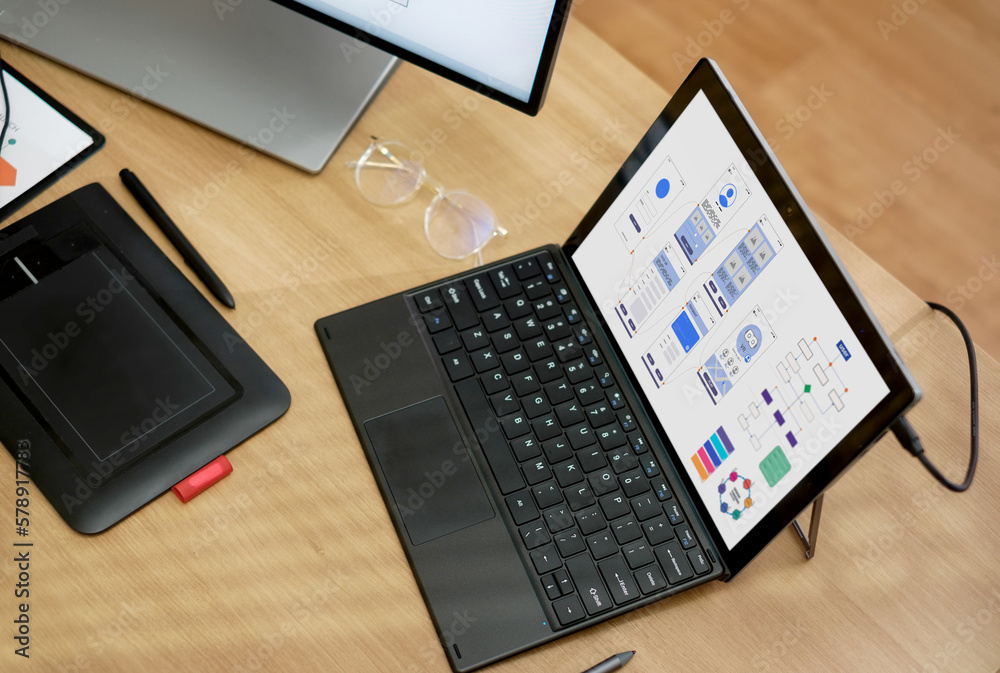 ux ui design on desktop and laptop computer screen working at home ...