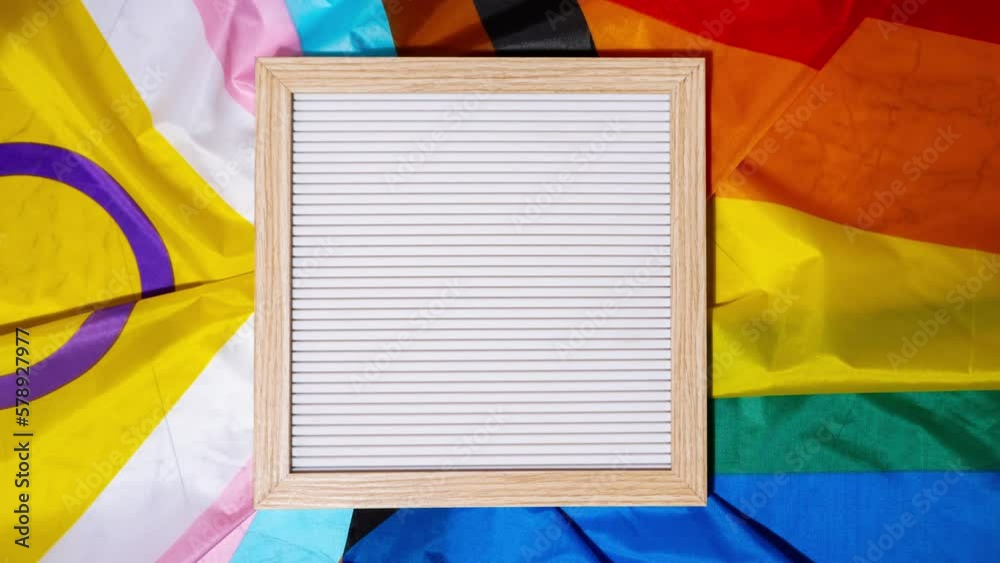 Stop motion HAPPY PRIDE MONTH frame on Rainbow LGBTQIA flag made from ...