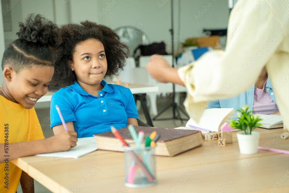 Black girl are taking test in elementary classroom school with diverse ...