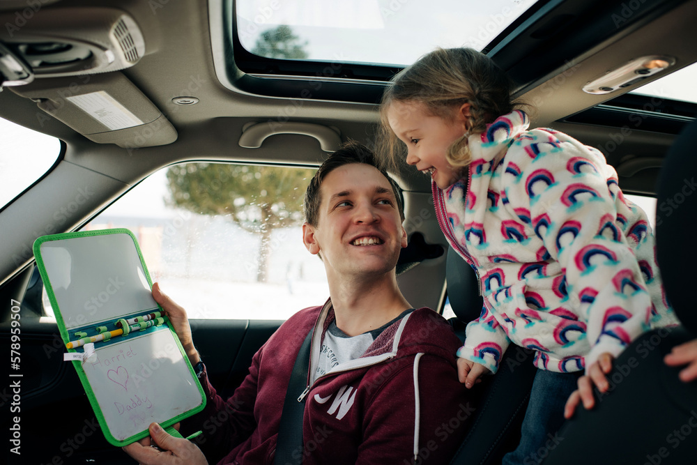 father and daughter drawing in the car smiling having fun Stock Photo ...
