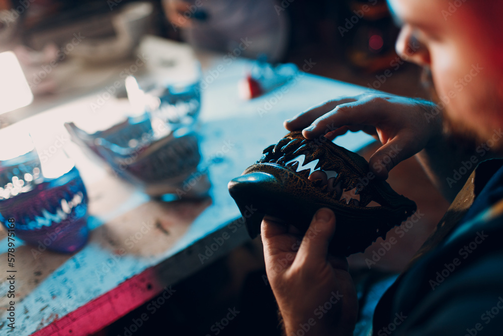 Artisan craftsman create mask based on plaster cast. Gypsum mold and ...