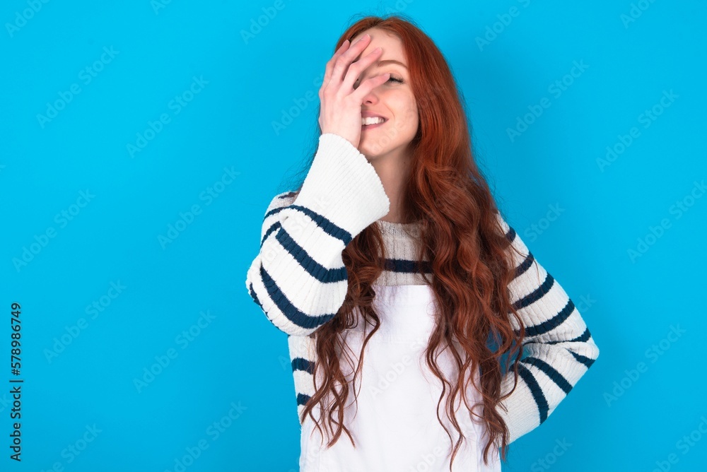 Charismatic carefree joyful young caucasian woman wearing overalls over ...