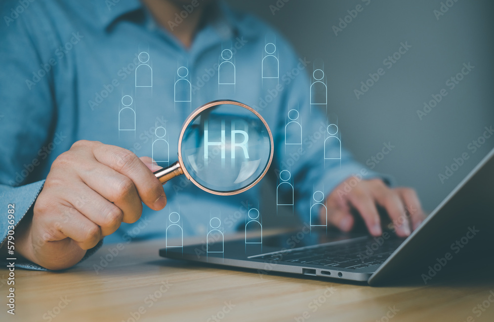 Businessman showing human resources virtual icon or HRM, magnifying ...