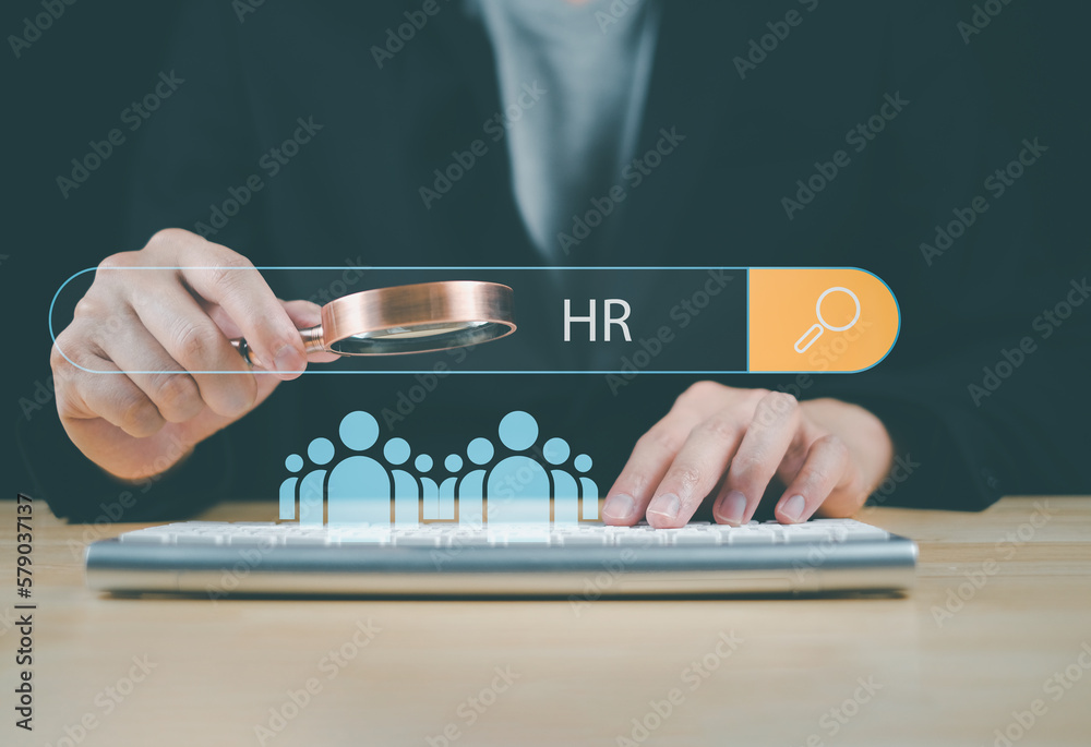Businessman showing human resources virtual icon or HRM, magnifying ...