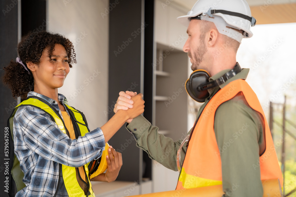 Architect team and Colleagues mixed race, join hands to join forces to ...