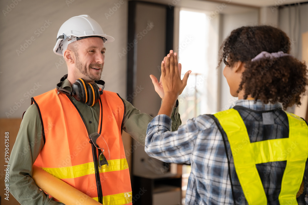 Architect team and Colleagues mixed race, join hands to join forces to ...