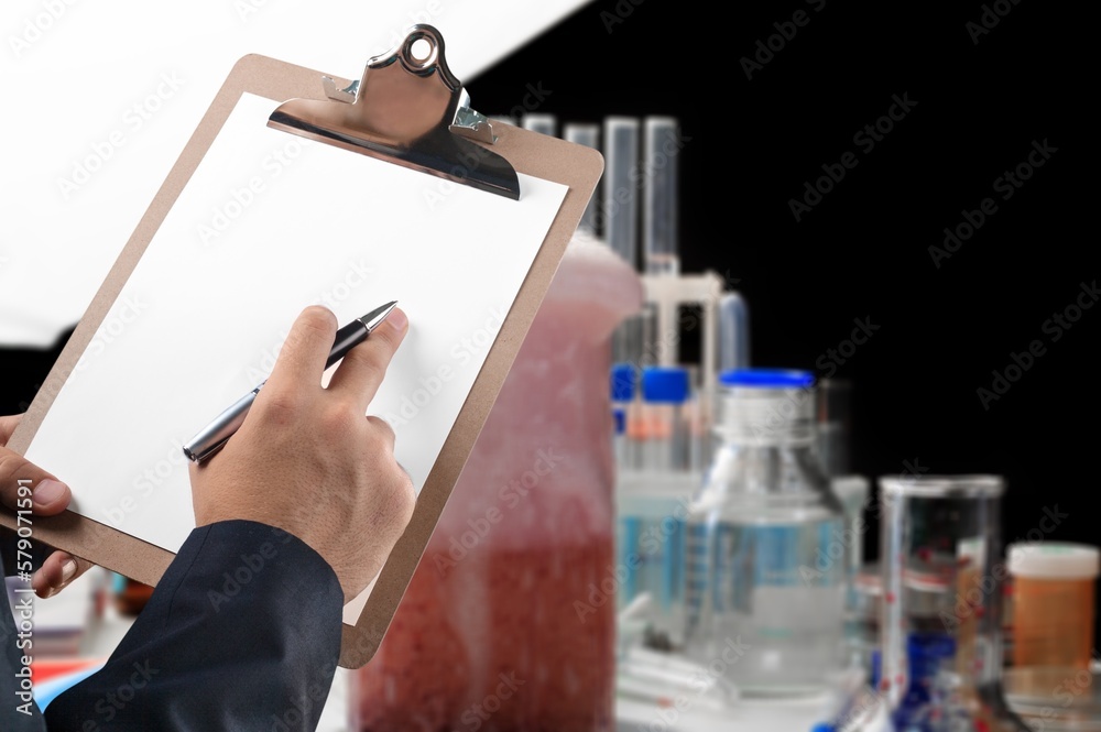 Food safety management. Inspector filling form in a laboratory, Stock ...