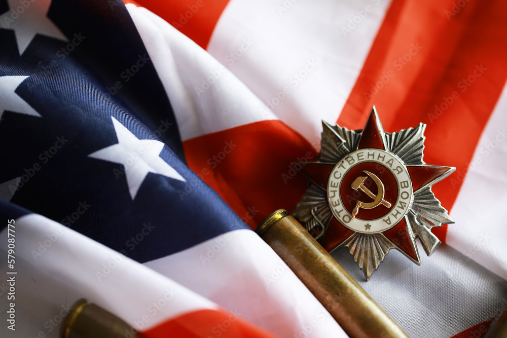 Many bullets cartridges and medals on United States flag. Concept of ...