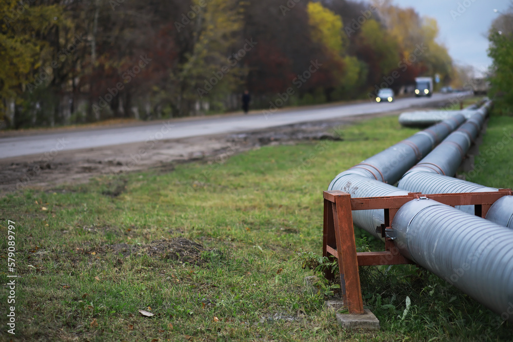 Metal pipes on the street. pipes from the pipeline. gas pipeline for ...