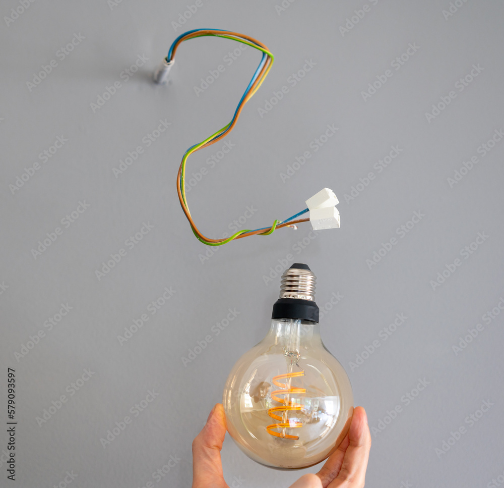 Symbol for installing light in a renovated house. Light cable in a grey ...