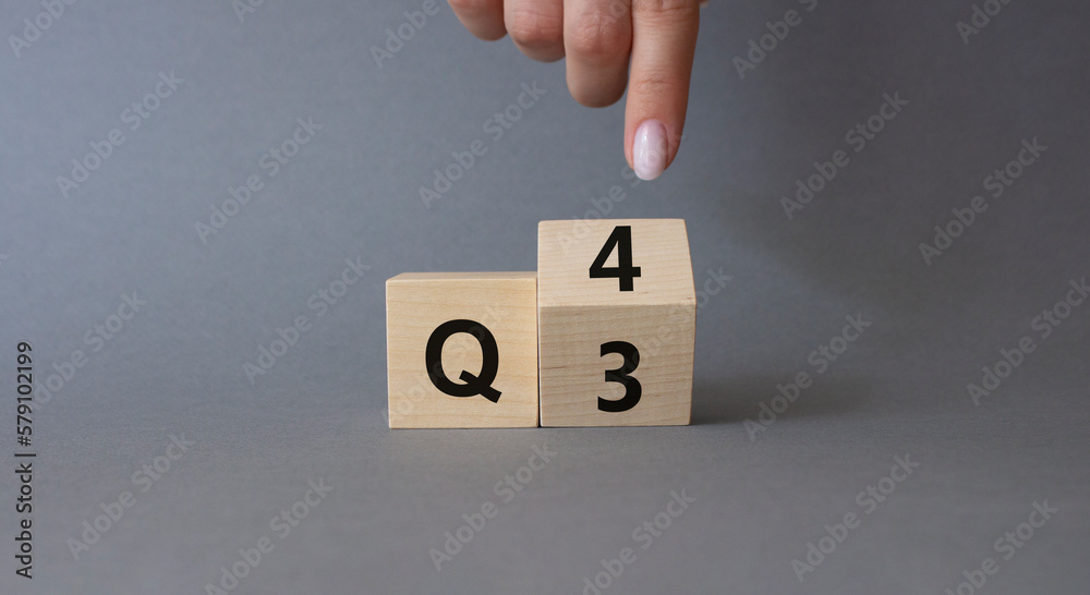 From 3rd Quarter to 4th symbol. Businessman hand points at turned ...