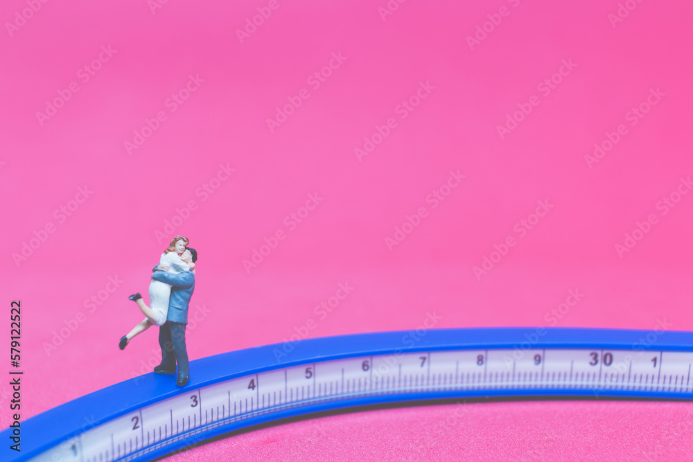 Miniature people : Couple hugging on The bridge Stock Photo | Adobe Stock