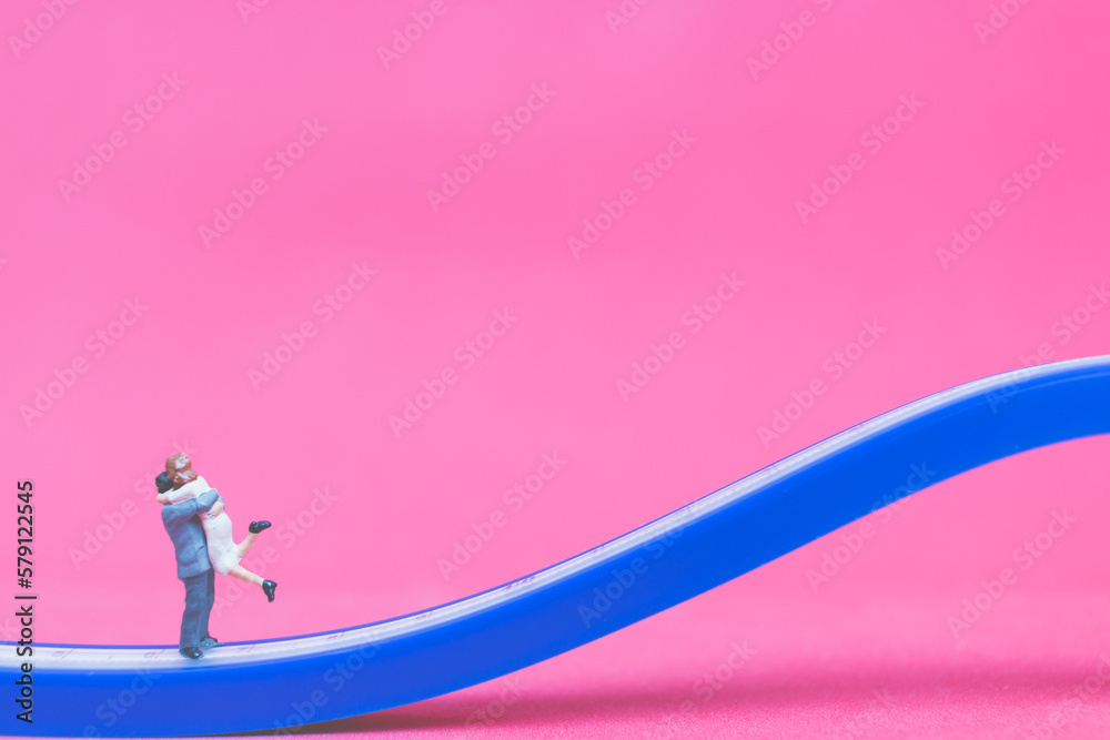 Miniature people : Couple hugging on The bridge Stock Photo | Adobe Stock