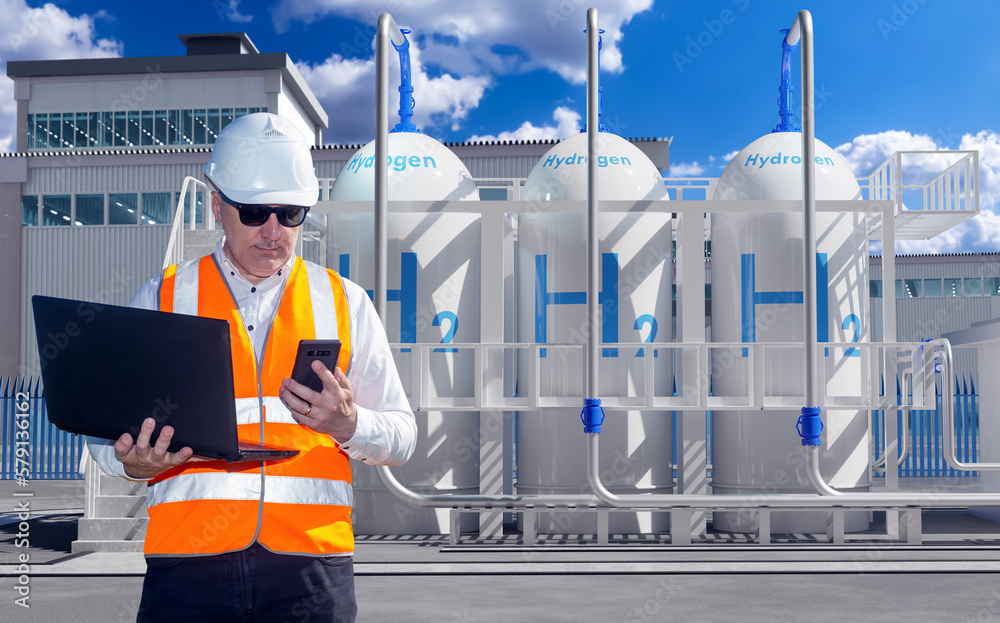 Stockfoto Engineer at hydrogen plant. Tanks with h2 gas behind man. Guy ...