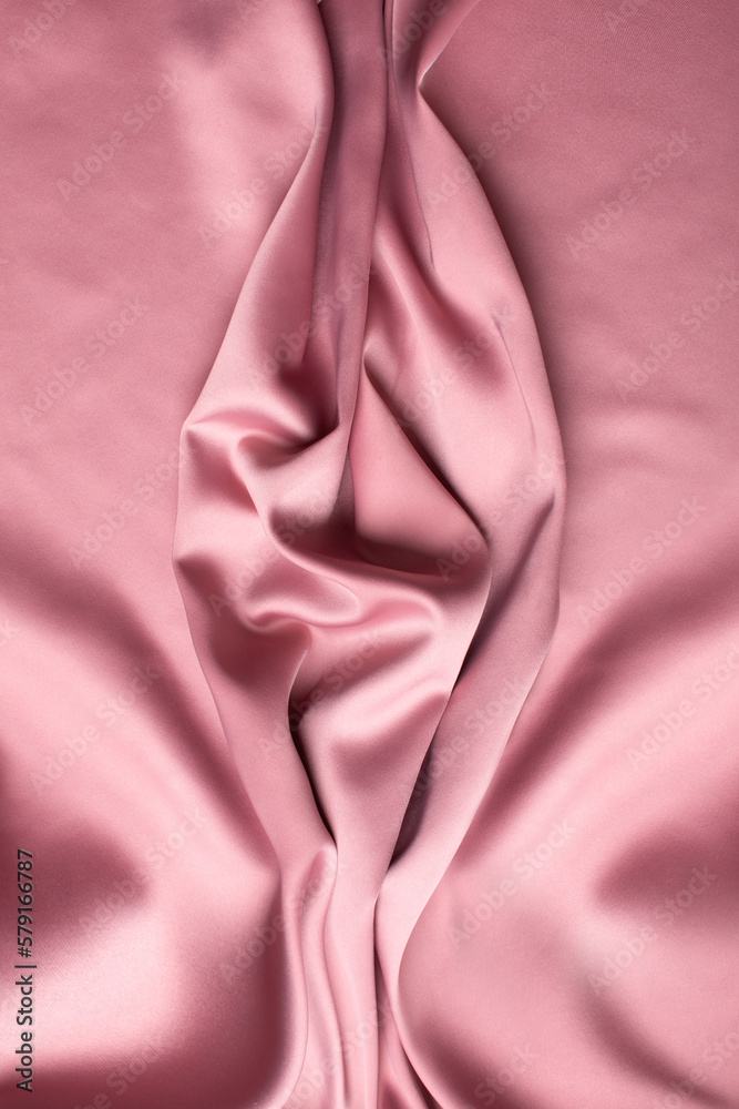 Pink soft fabric shaped as female genital organs, vulva and labia ...