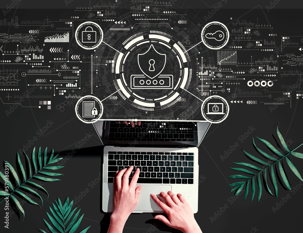 Cyber security theme with person using a laptop computer Stock Photo ...
