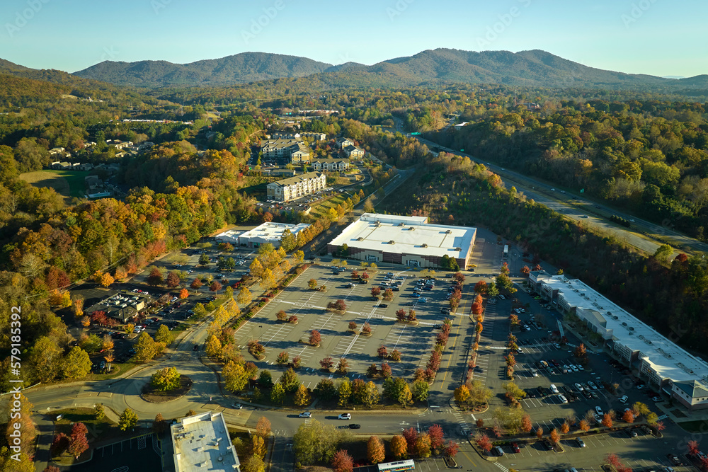 Aerial view grocery shopping mall and many colorful cars parked on ...