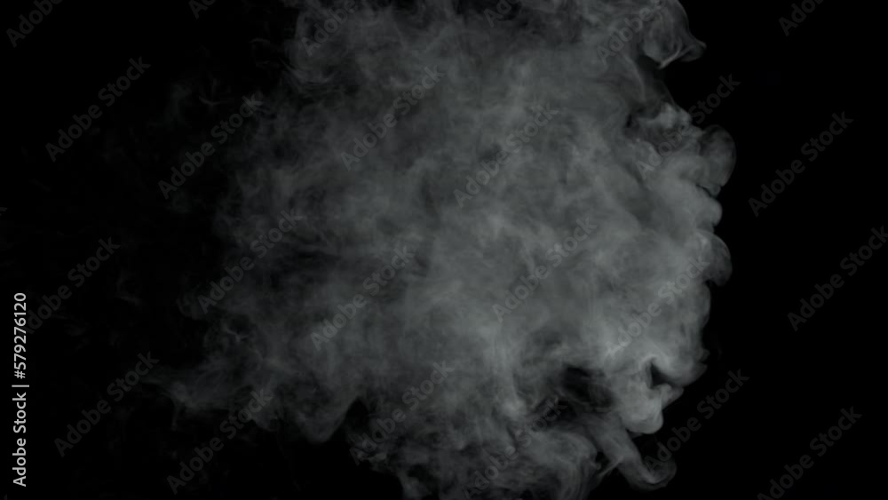 Turbulent smoke reveal on black background. This can be an overlay with ...