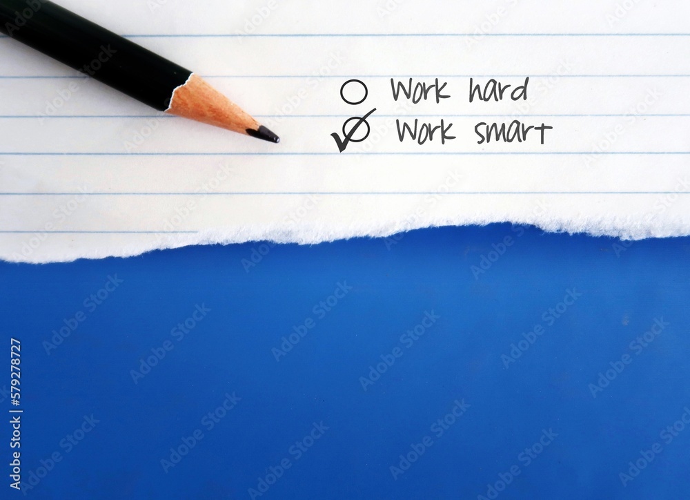 Pencil on torn note paper with checkbox WORK HARD, WORK SMART concept ...