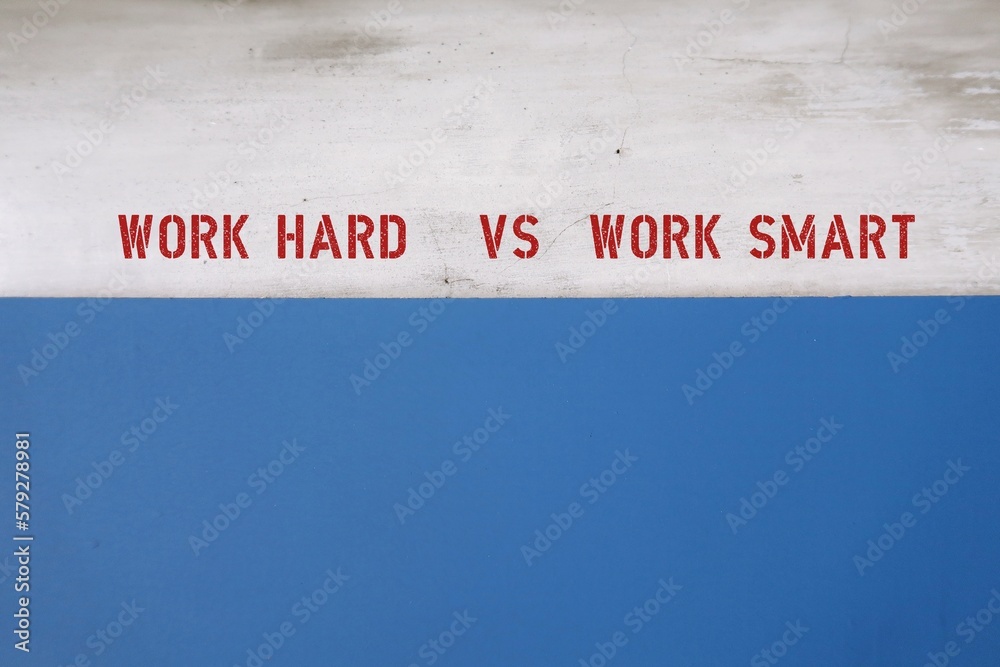 Foto de copy space blue and grey wall with text WORK HARD VS WORK SMART ...